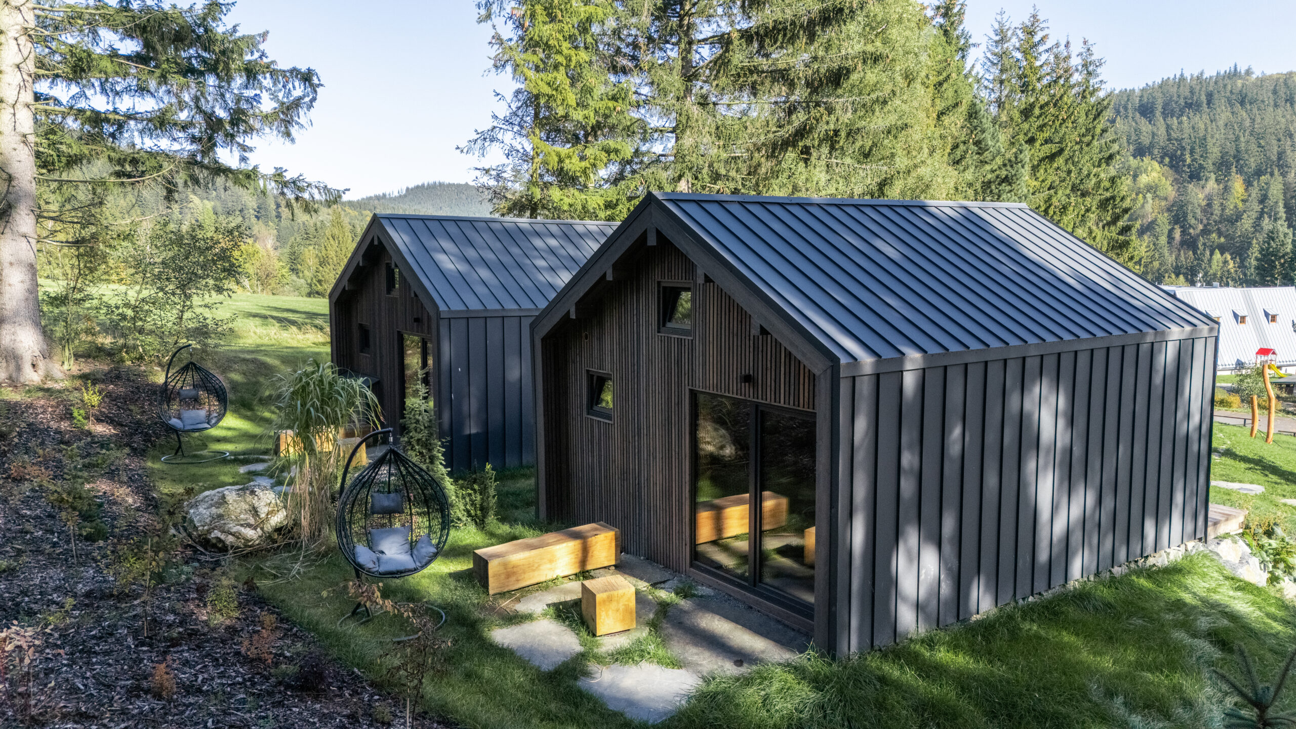 Modern mountain-style chalets for year-round use, located in a ...